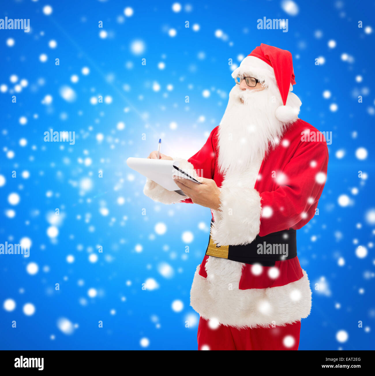 man in costume of santa claus with notepad Stock Photo - Alamy