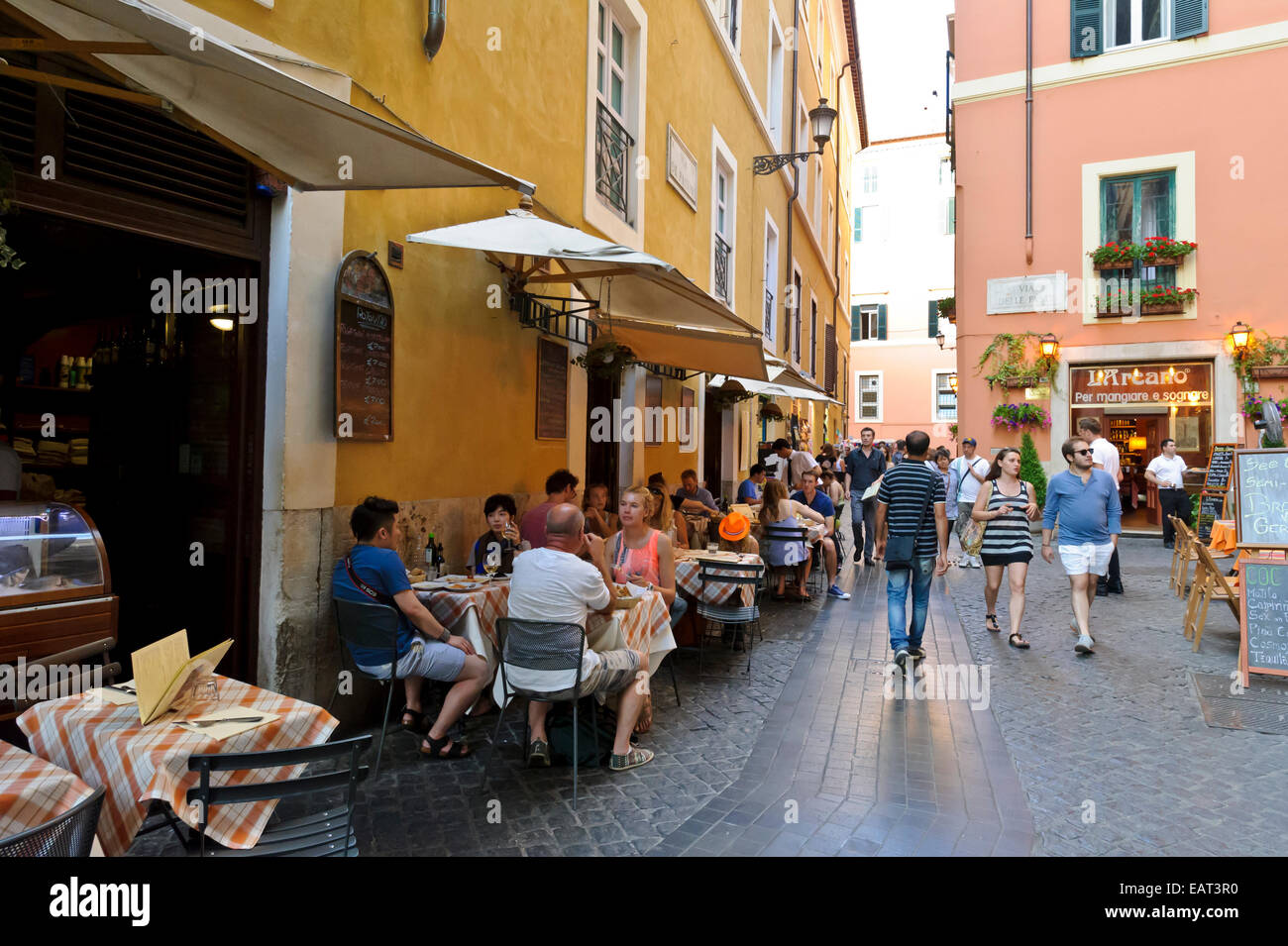 People dining in traditional restaurants in narrow street in the City ...