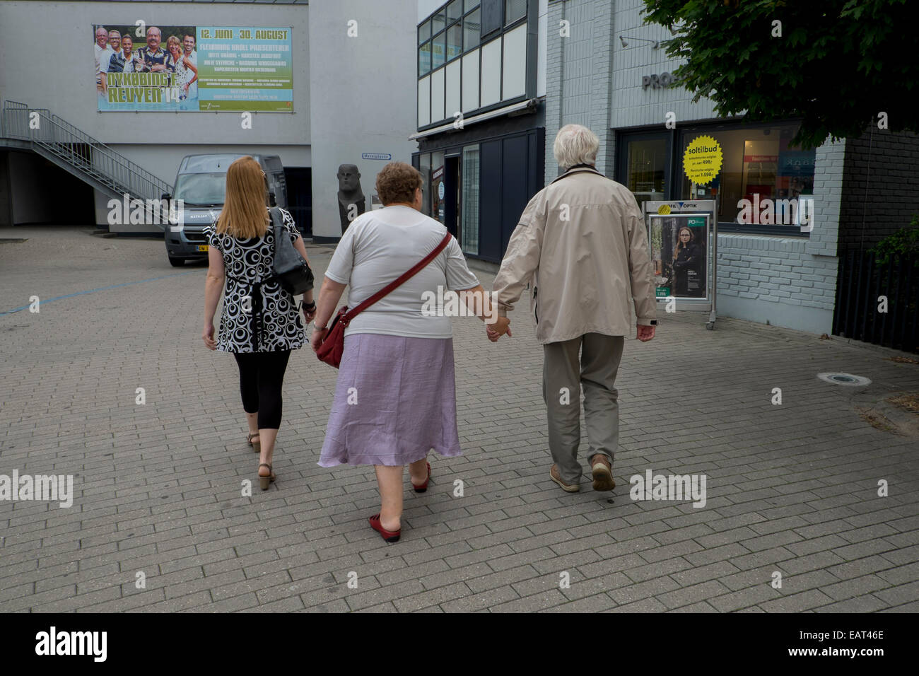Elderly couple holding hands Stock Photo - Alamy