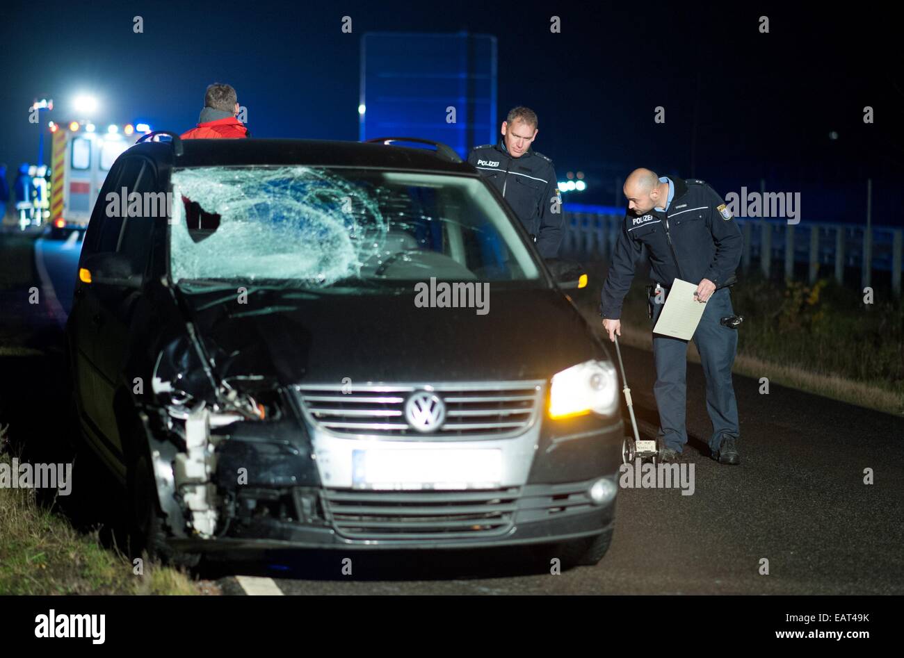 Weimar, Germany. 19th Nov, 2014. Police officers secure the car that ...