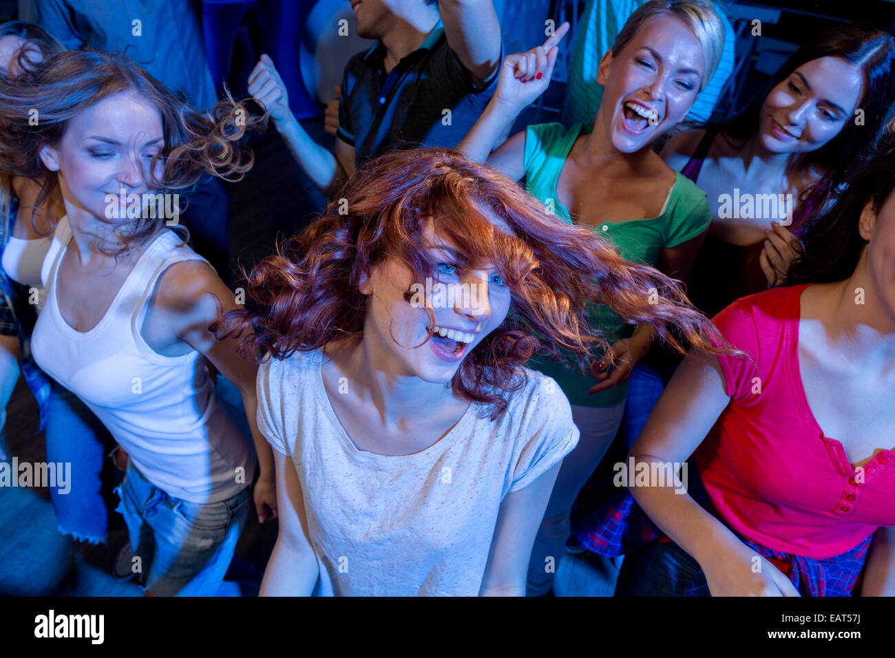 smiling friends dancing in club Stock Photo - Alamy