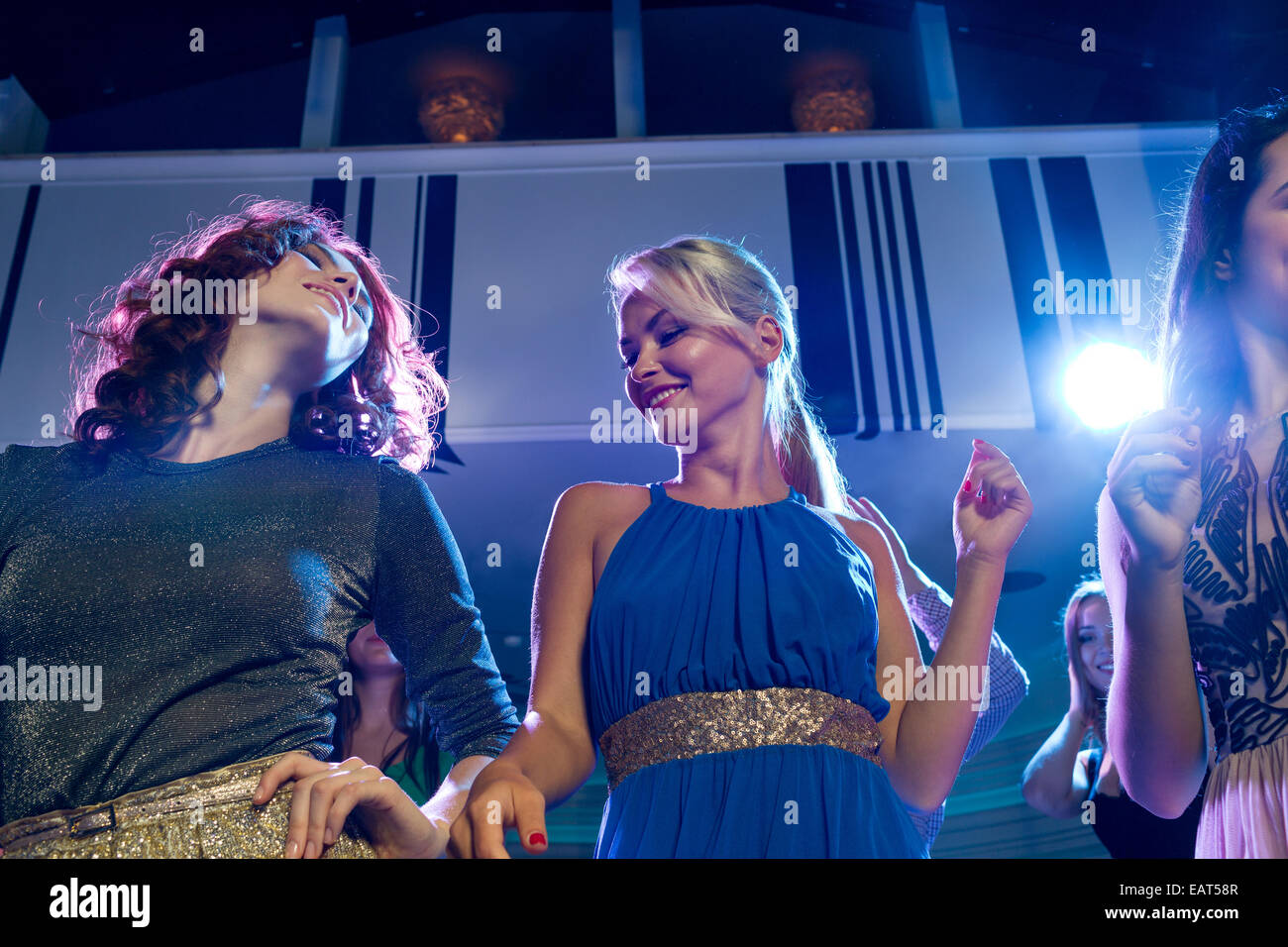 smiling friends dancing in club Stock Photo - Alamy