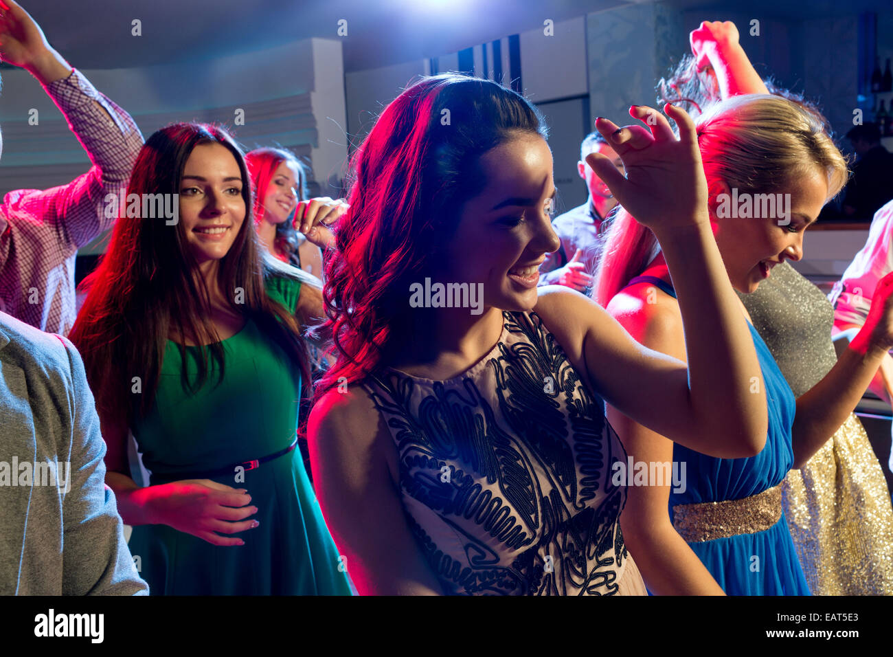 smiling friends dancing in club Stock Photo - Alamy