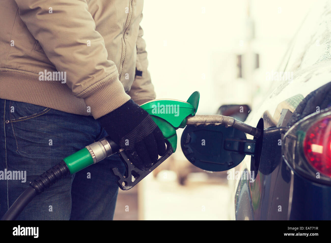 close up of male refilling car fuel tank Stock Photo - Alamy