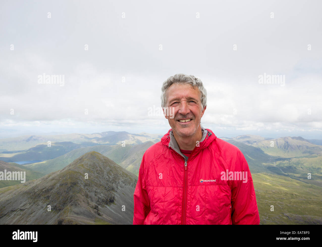 A Munro bagger on the summit of Ben More, a Munro on the Isle of Mull ...