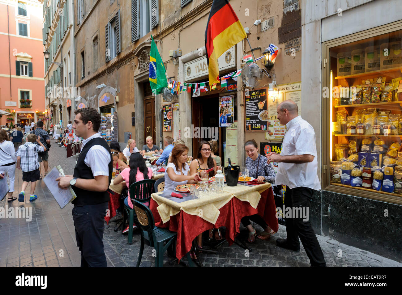 People dining in traditional restaurants in narrow street in the City ...