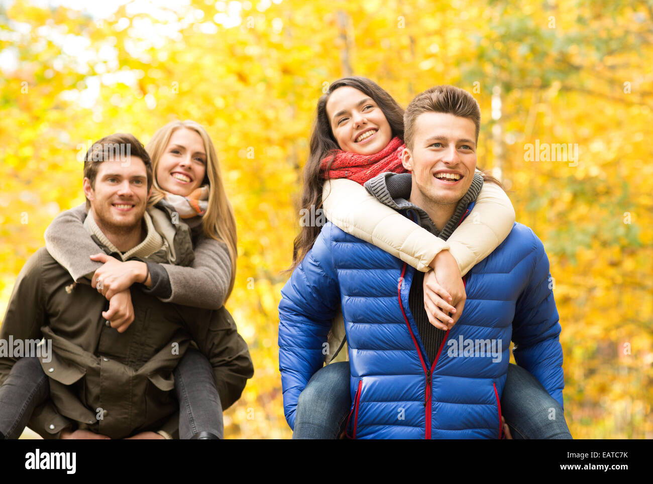 smiling friends having fun in autumn park Stock Photo - Alamy