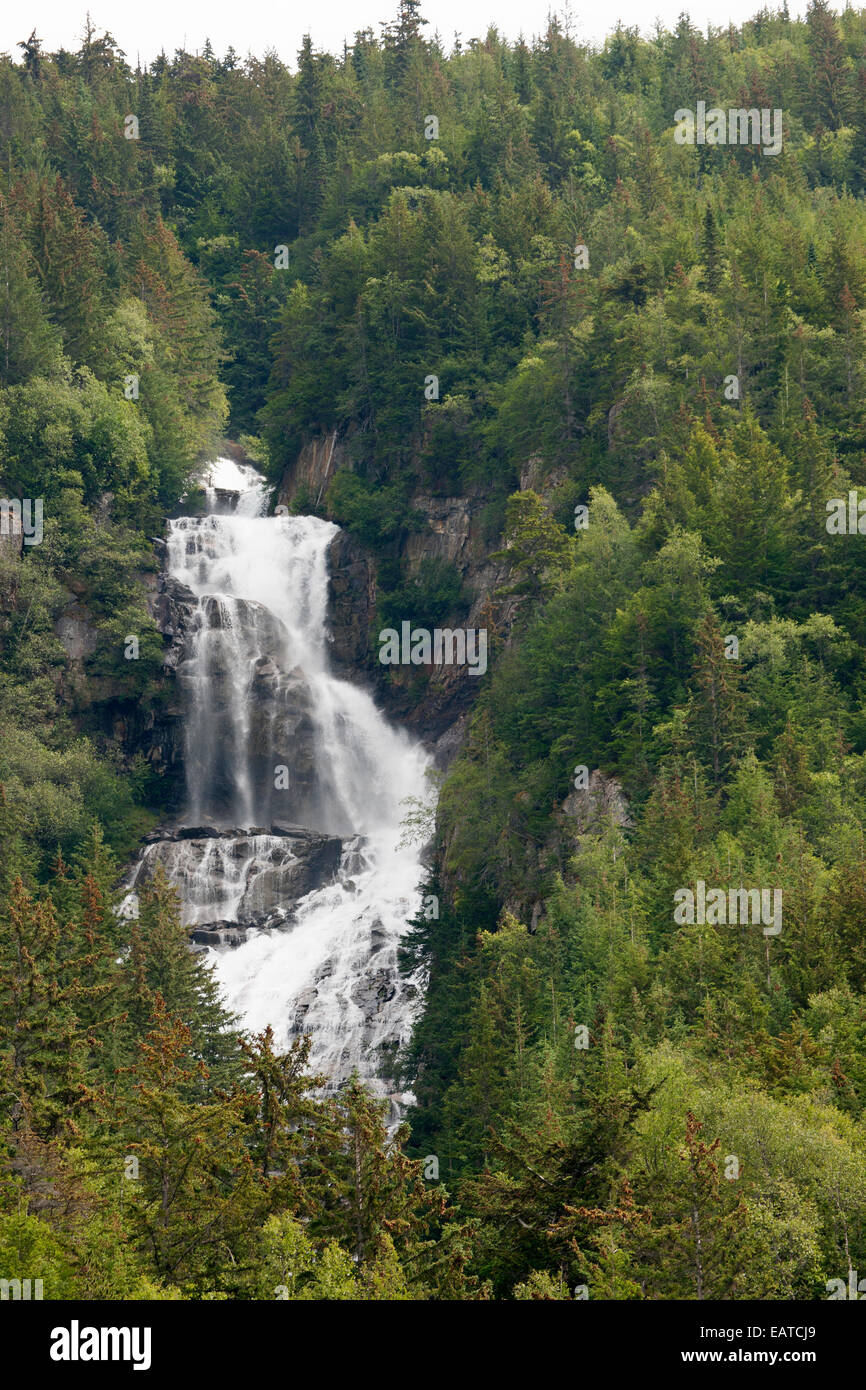 Waterfall descending into Glacier bay leading to Skagway - Alaska Stock ...