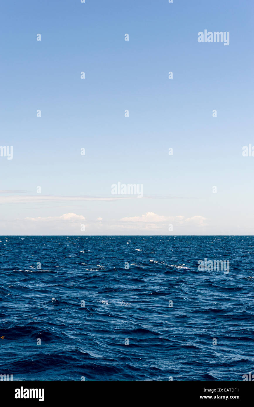 A calm ocean surface stretching all the way to the horizon Stock Photo ...