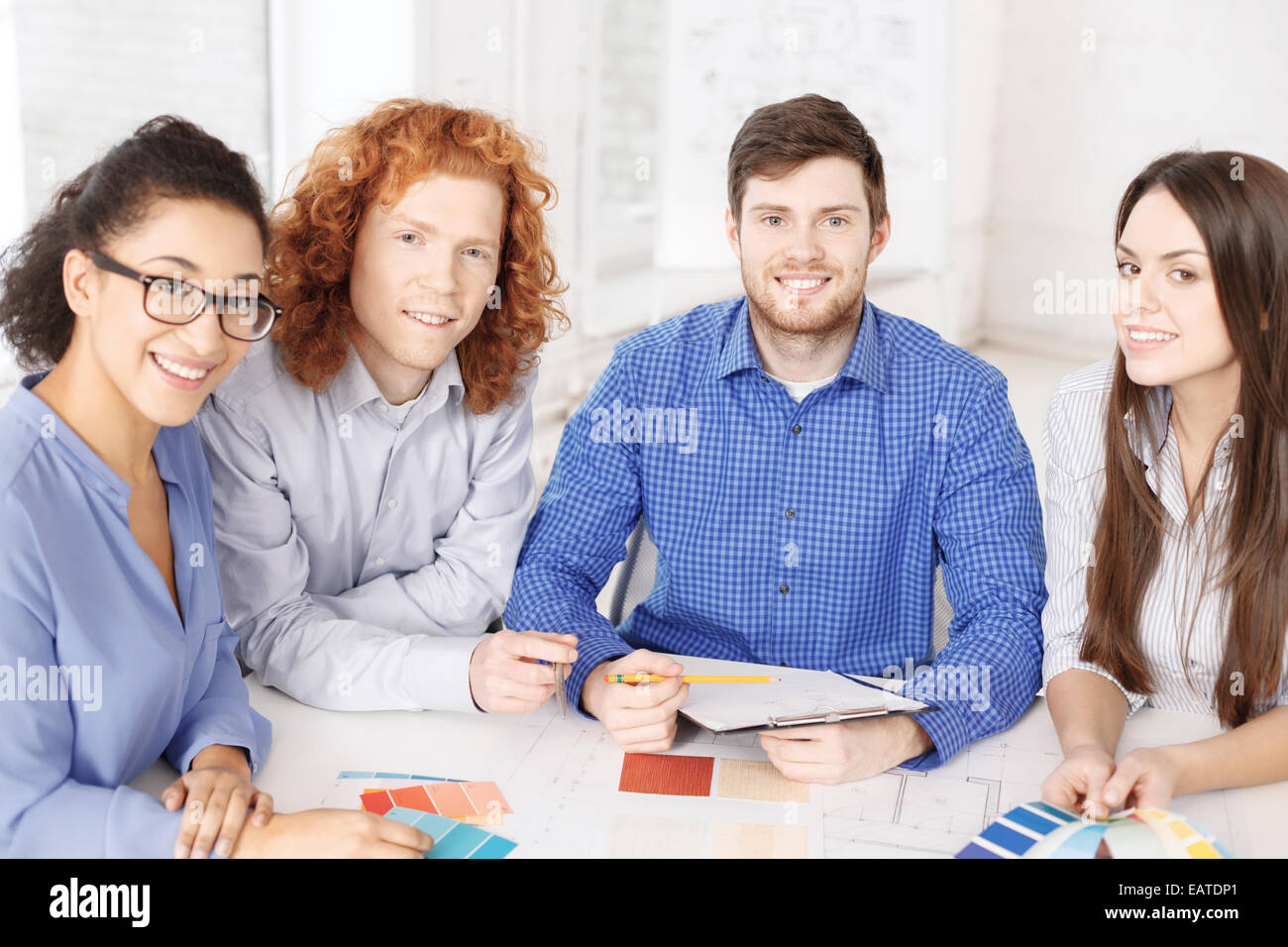 team with color samples and blueprint at office Stock Photo - Alamy