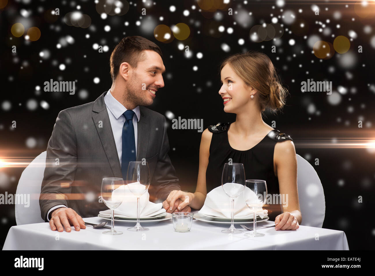 smiling couple at restaurant Stock Photo - Alamy