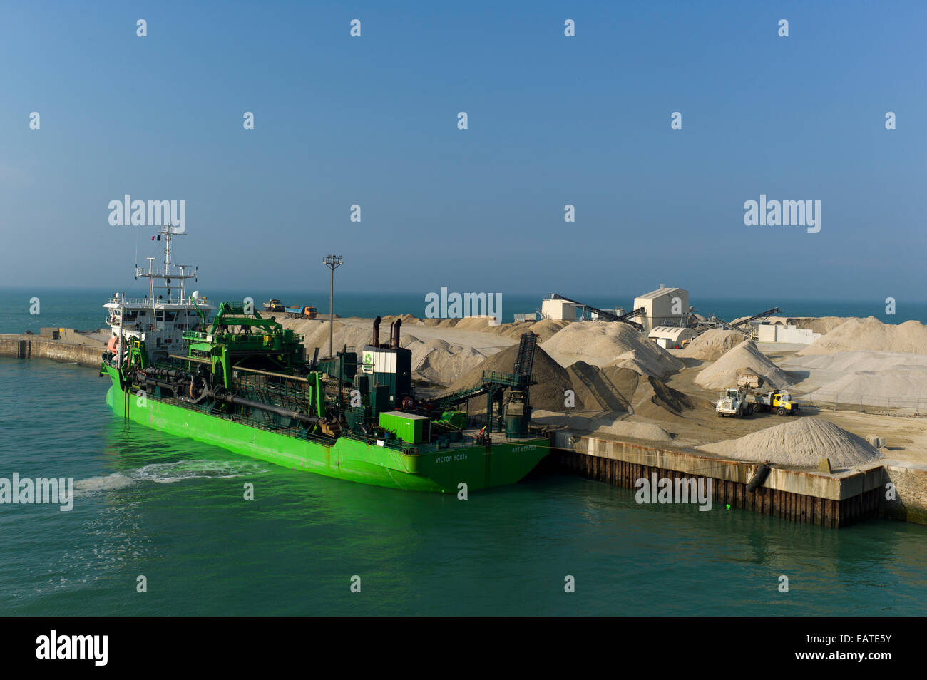 Gravel and sand being loaded onto ship Stock Photo - Alamy