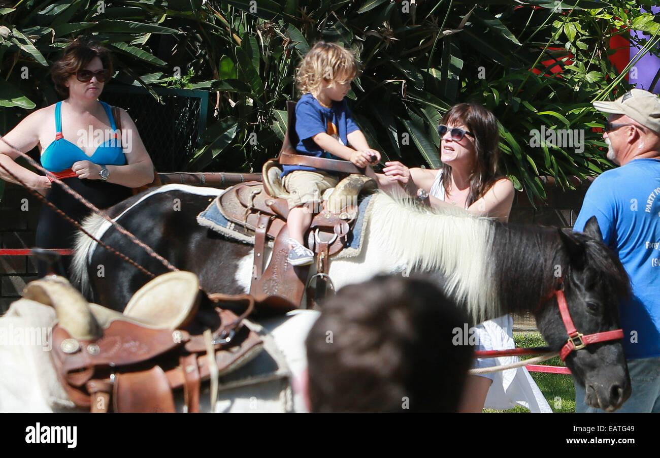 Selma Blair takes son Arthur Bleick on a pony ride at the Farmers ...