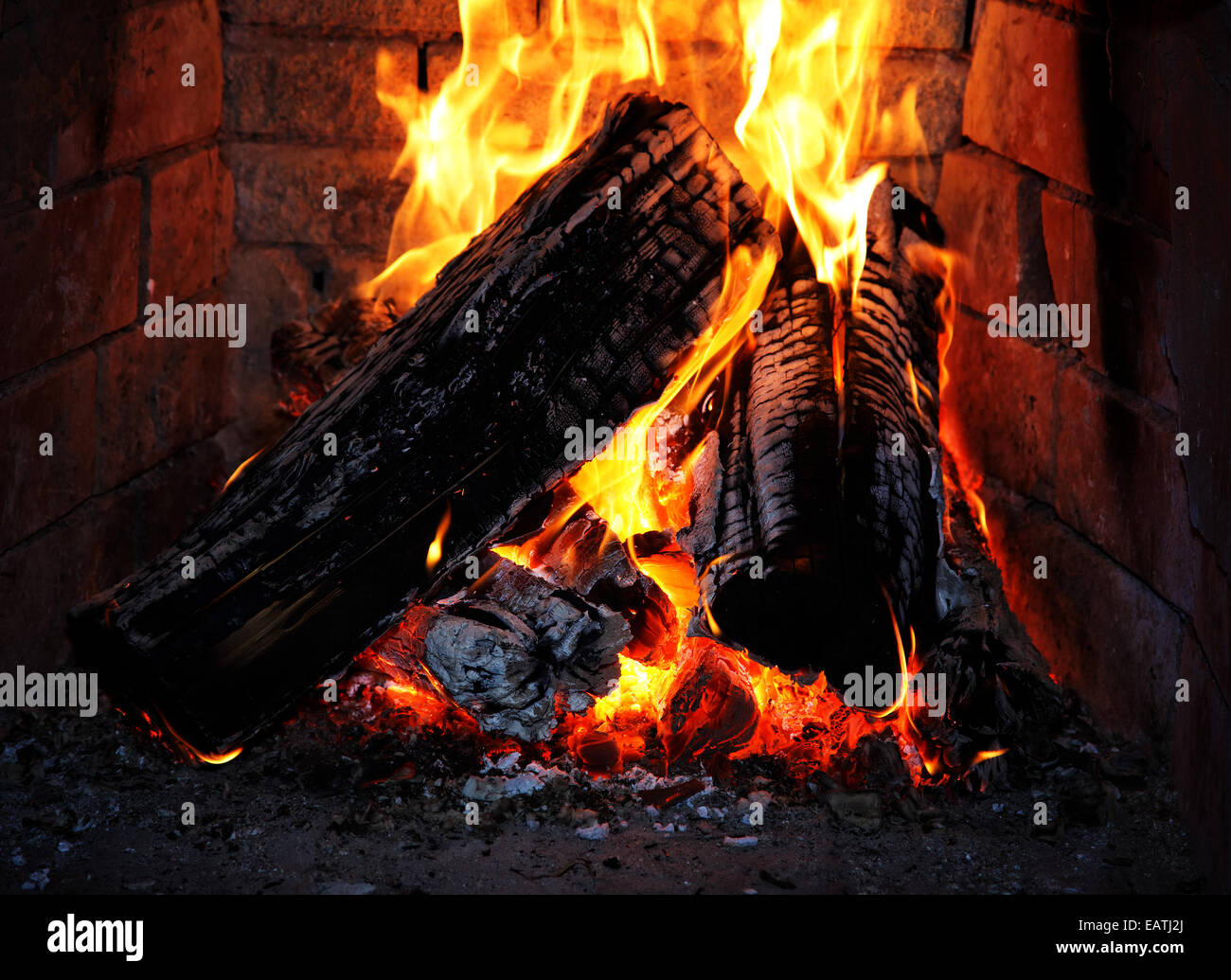 Burning fire wood in a fireplace Stock Photo - Alamy