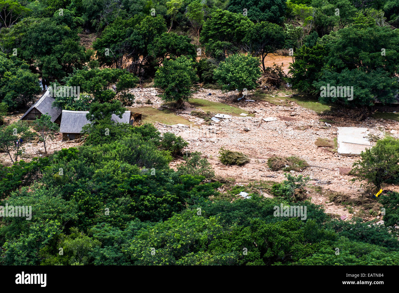 A village on a savannah plain destroyed by raging flood waters Stock ...