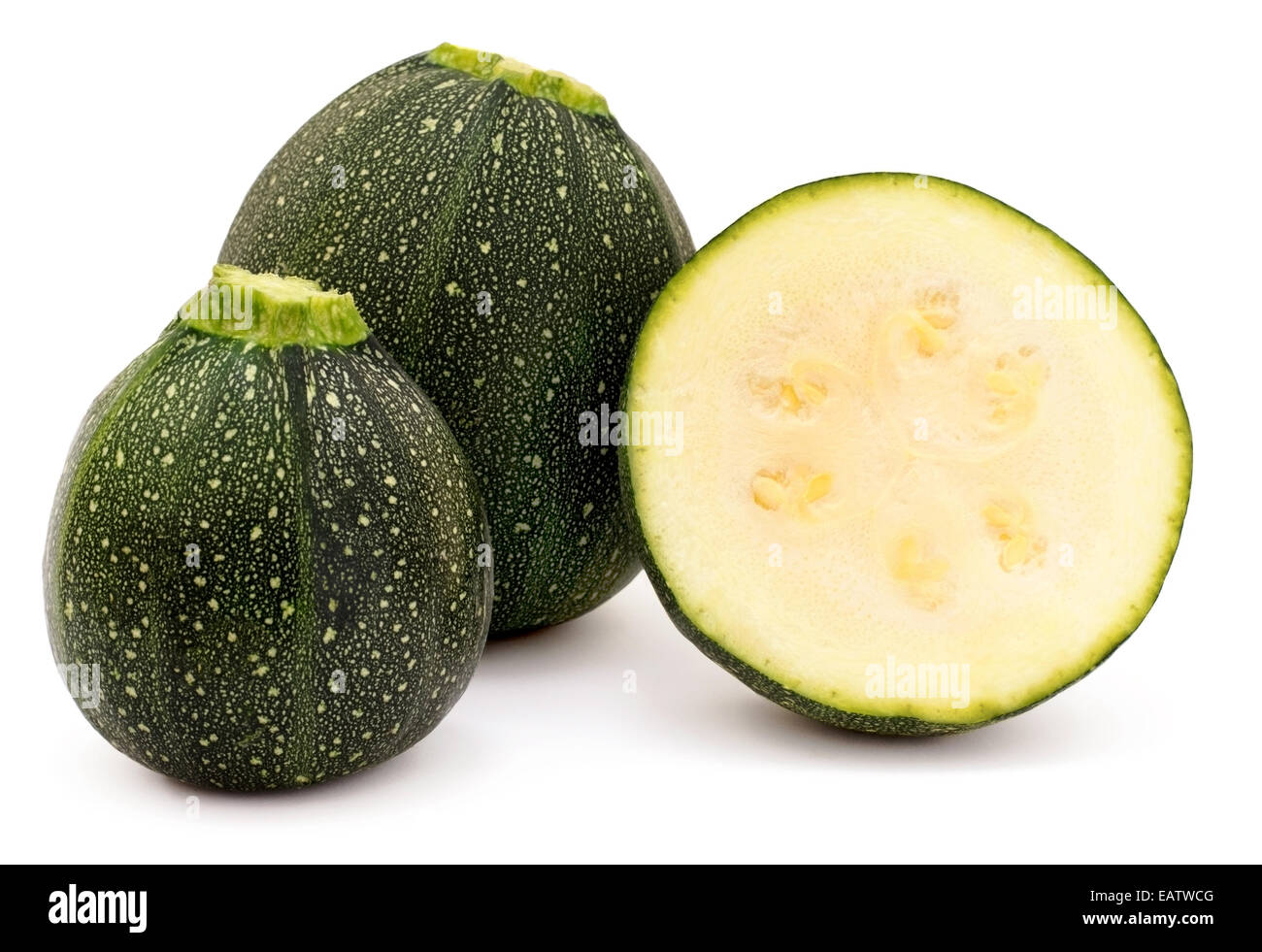 Round Courgettes whole and sliced on a white background Stock Photo - Alamy