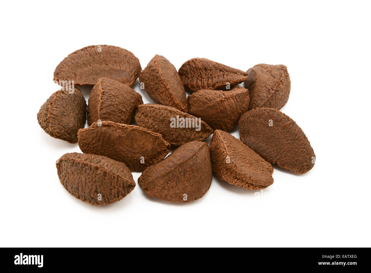 Brazil nuts in shells, isolated on a white background Stock Photo - Alamy