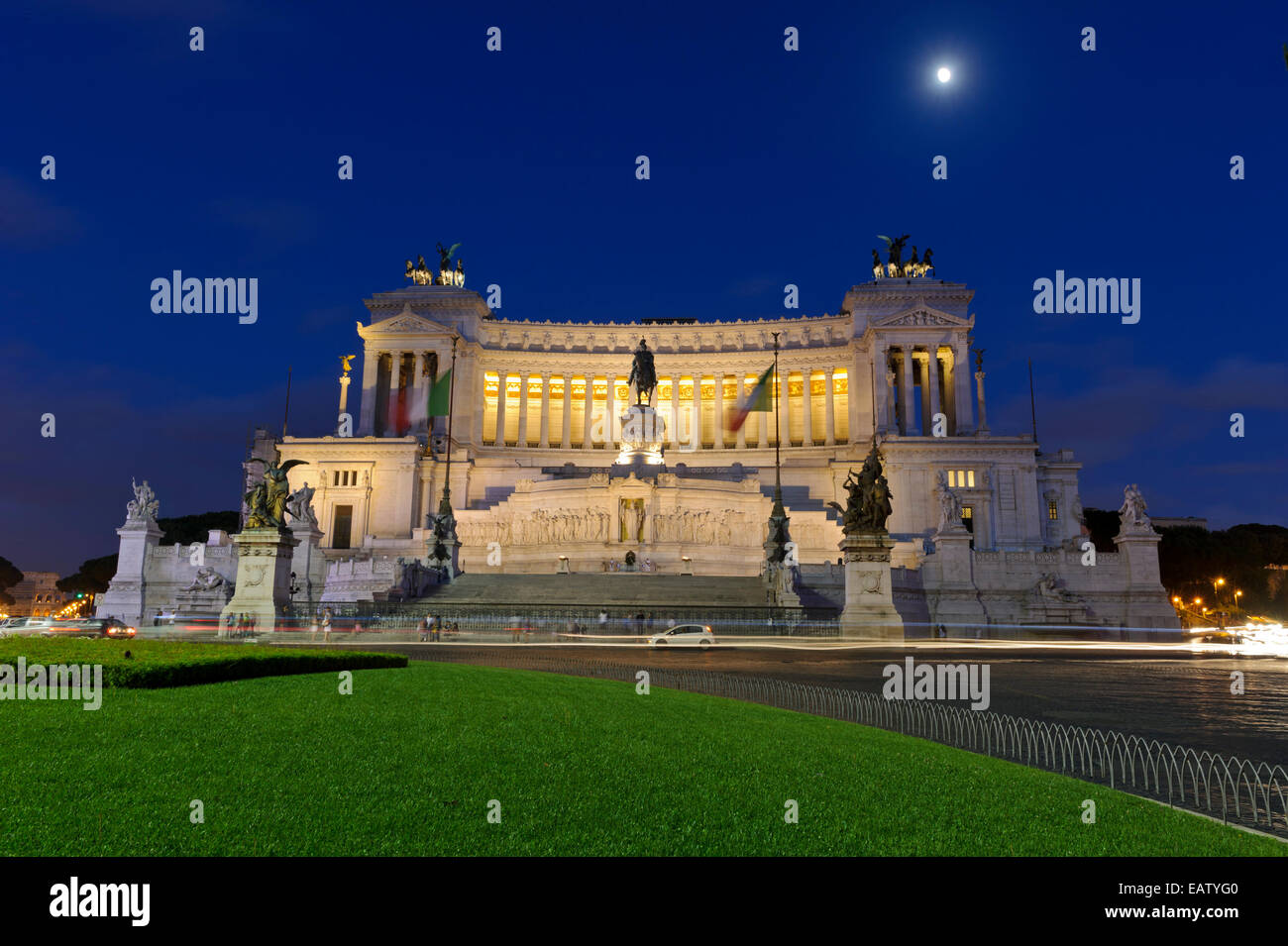 The Victor Emmanuel white building by night in Rome, Italy Stock Photo ...