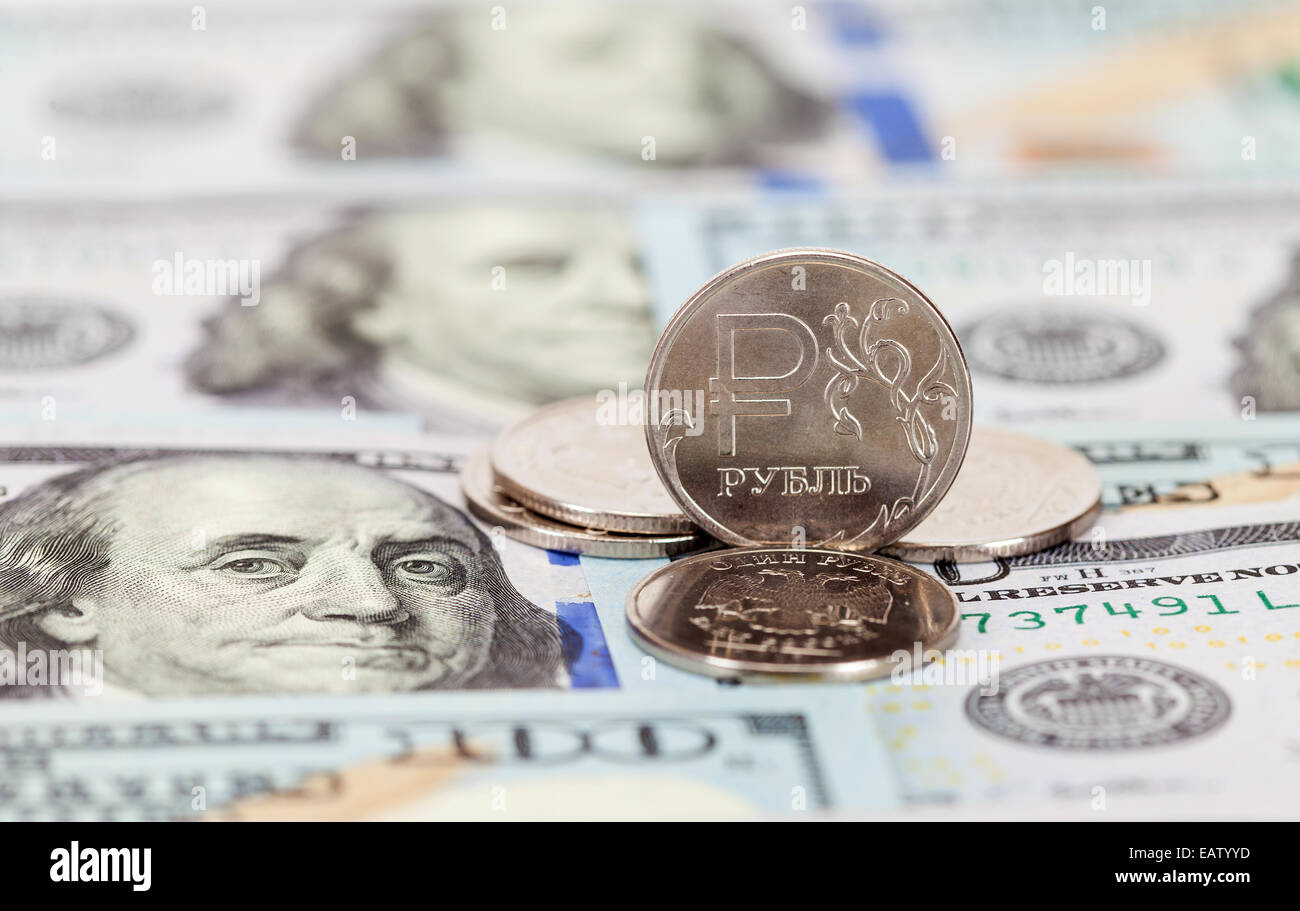 Russian rubles coins and dollars banknotes close up Stock Photo - Alamy