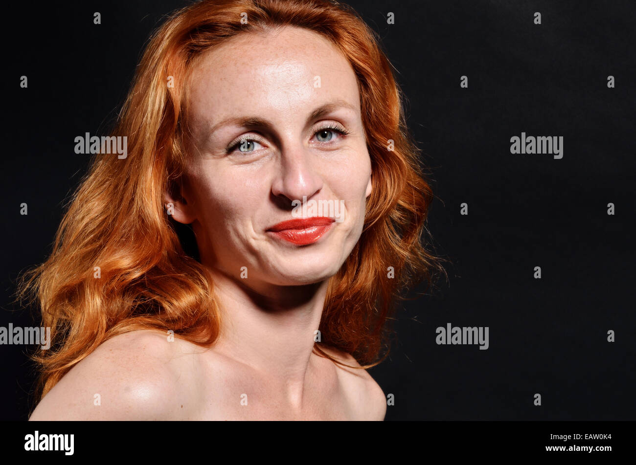 Redhead woman smiling Stock Photo - Alamy