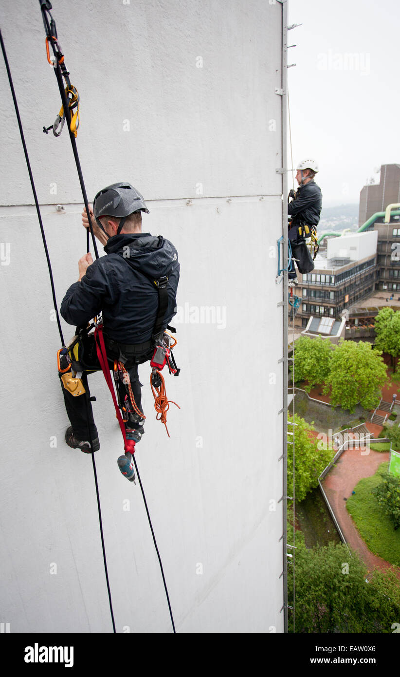Rope access technicians during assembly work in the city of Wuppertal ...
