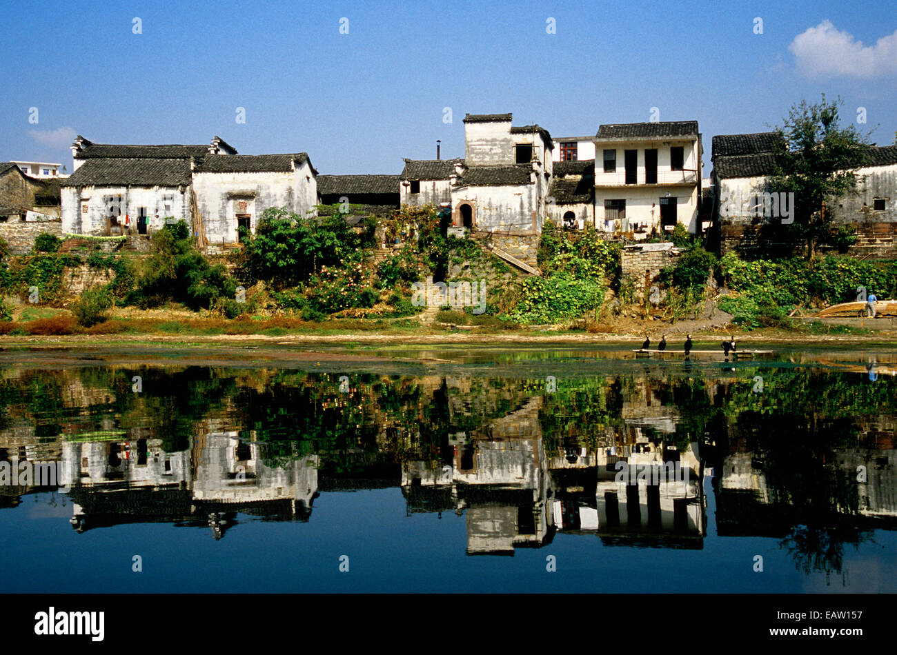 Anhui, China, village reflecting in river Stock Photo - Alamy