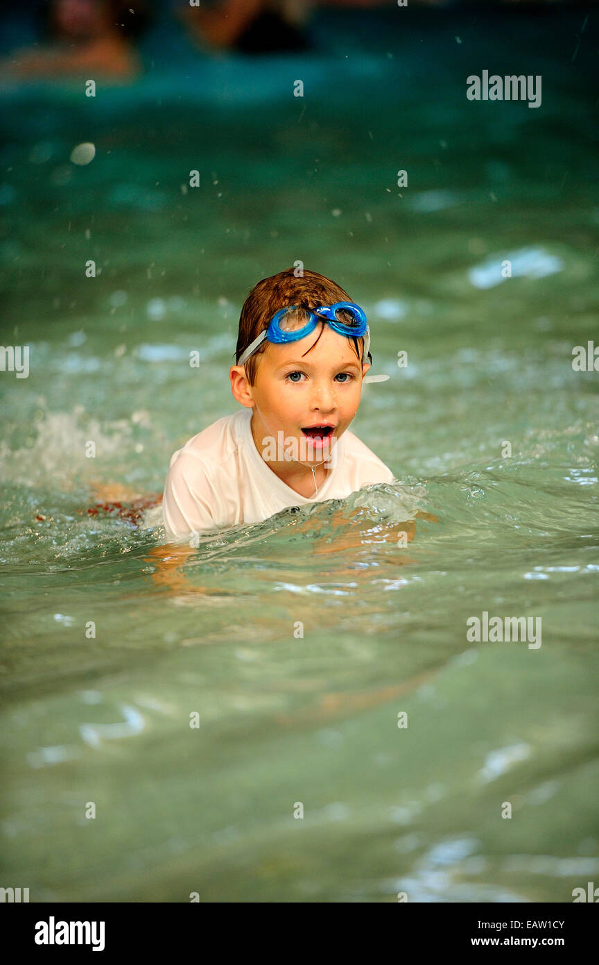 A young boy playing in a pool Stock Photo - Alamy