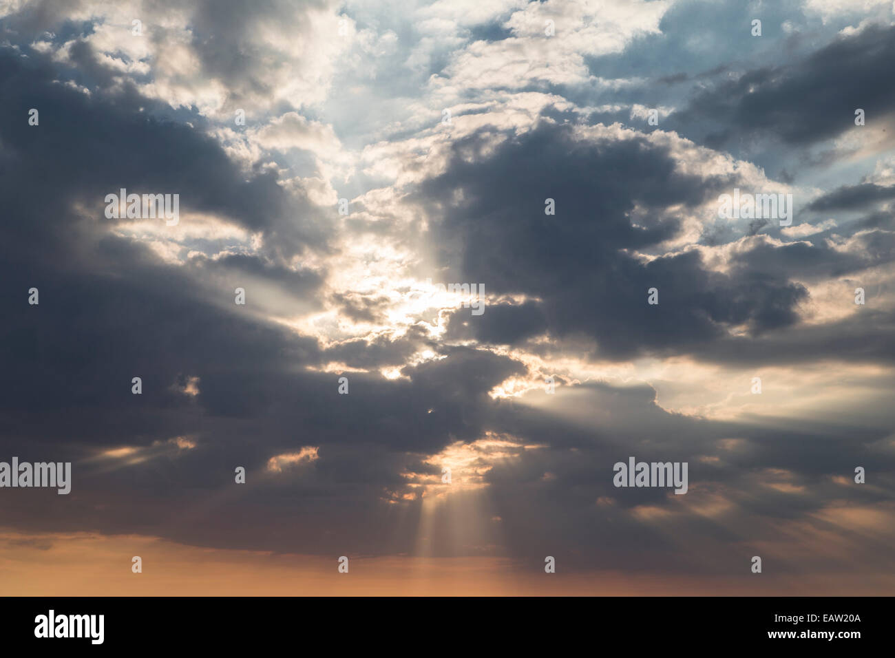 Image shows sunrise with clouds and light rays Stock Photo - Alamy