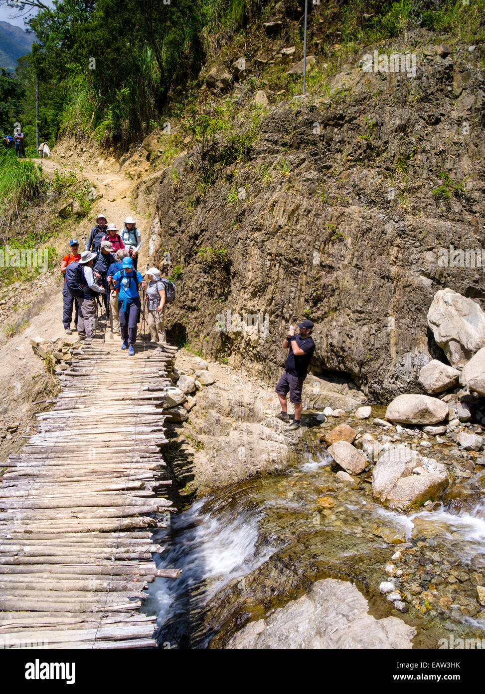 Woman hiking over stone bridge hi-res stock photography and images - Alamy