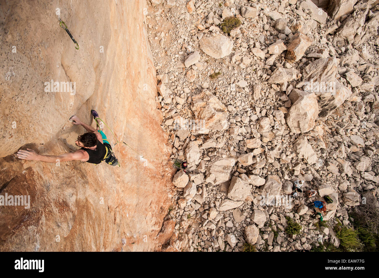 Professional climber Daniel Jung climbing in San Vito Lo Capo, being a ...