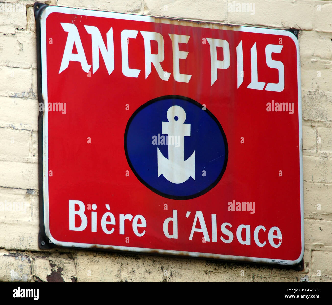 The image showcases an enamel advertising sign for Ancre Pils at the ...
