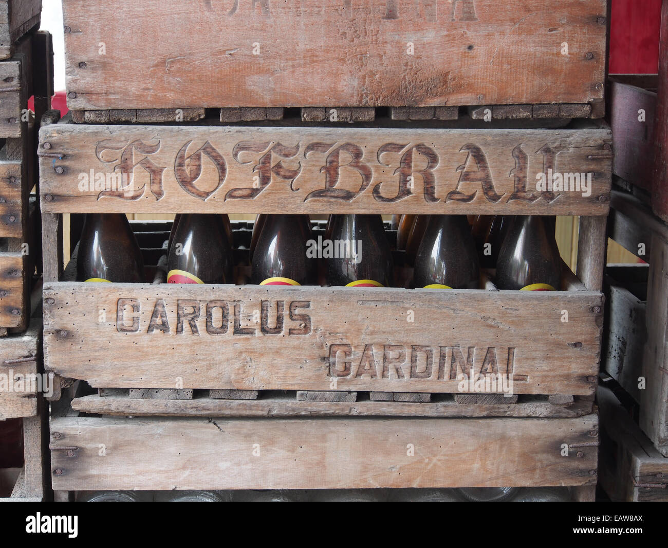 A Hofbrau Carolus Cardinal crate and enamel advertising sign on display ...