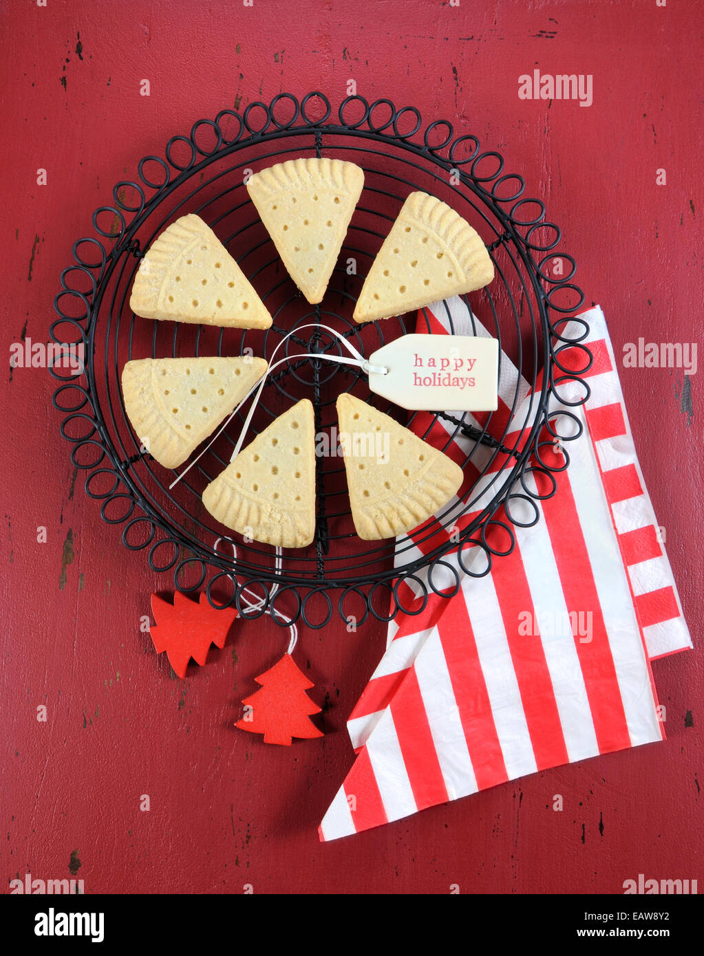 Christmas shortbread triangle cookies on vintage baking rack on dark ...