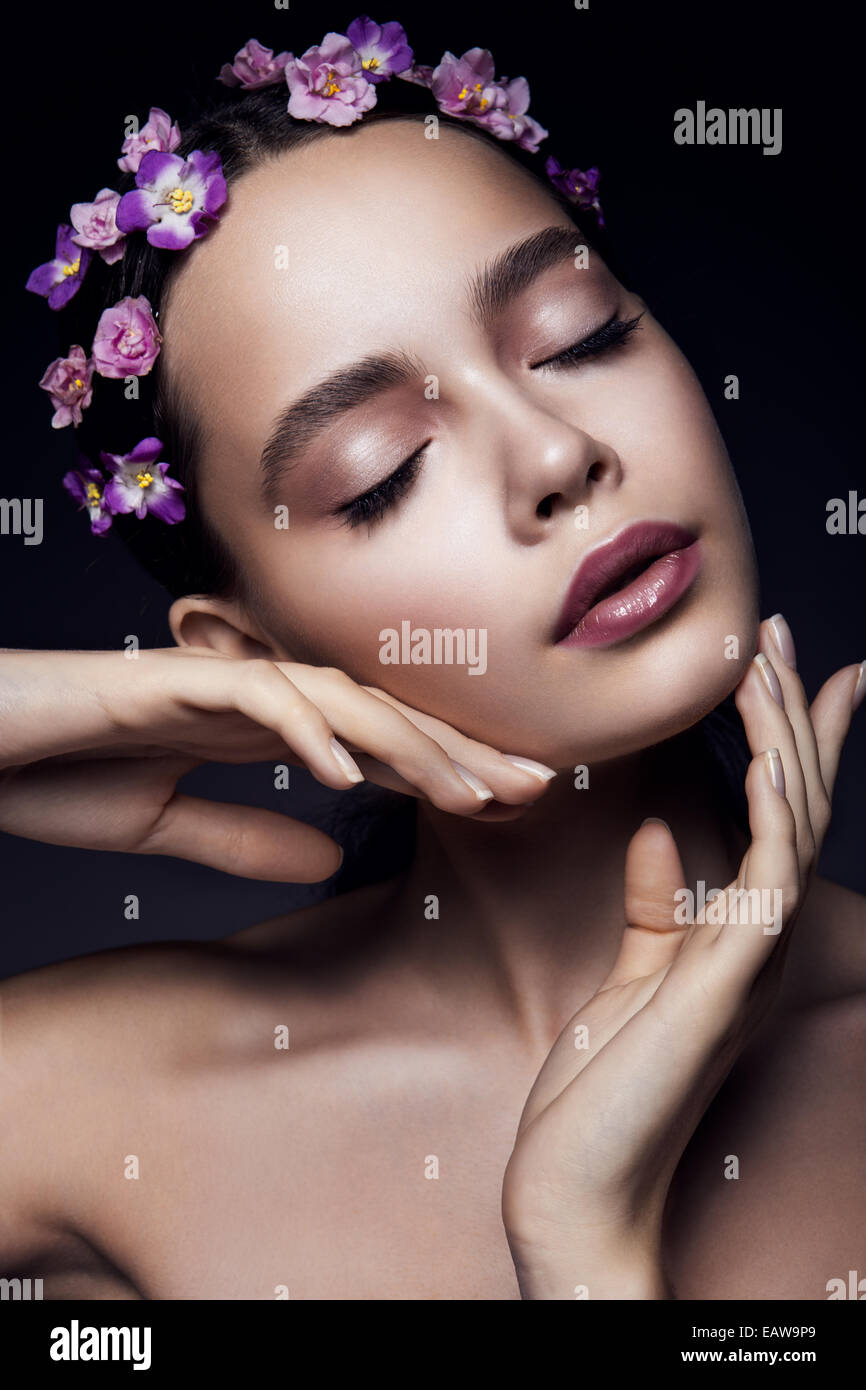 Beautiful girl with violet flowers Stock Photo - Alamy