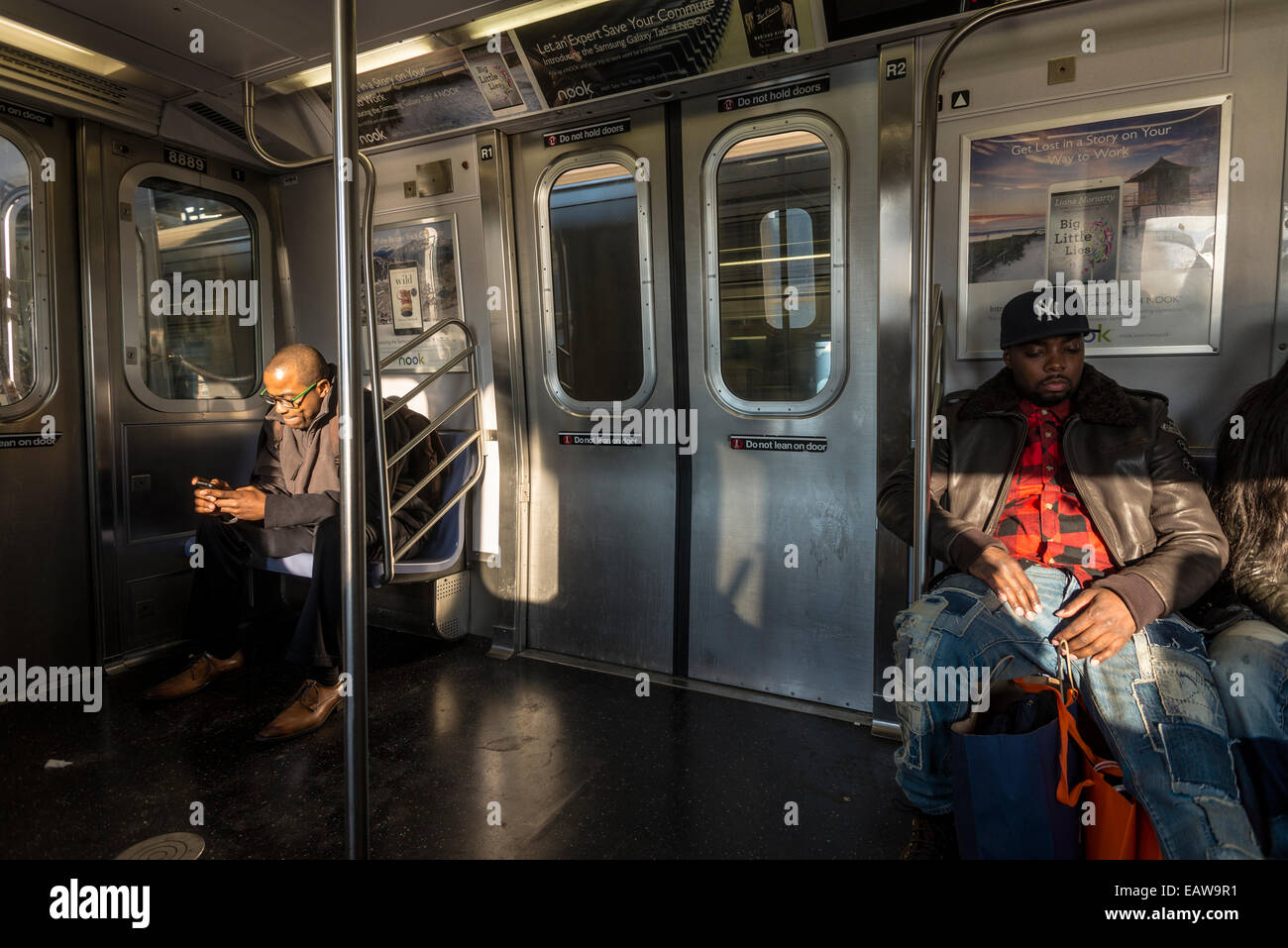 New York, NY 20 November 2014 - Subway riders on the N train to ...