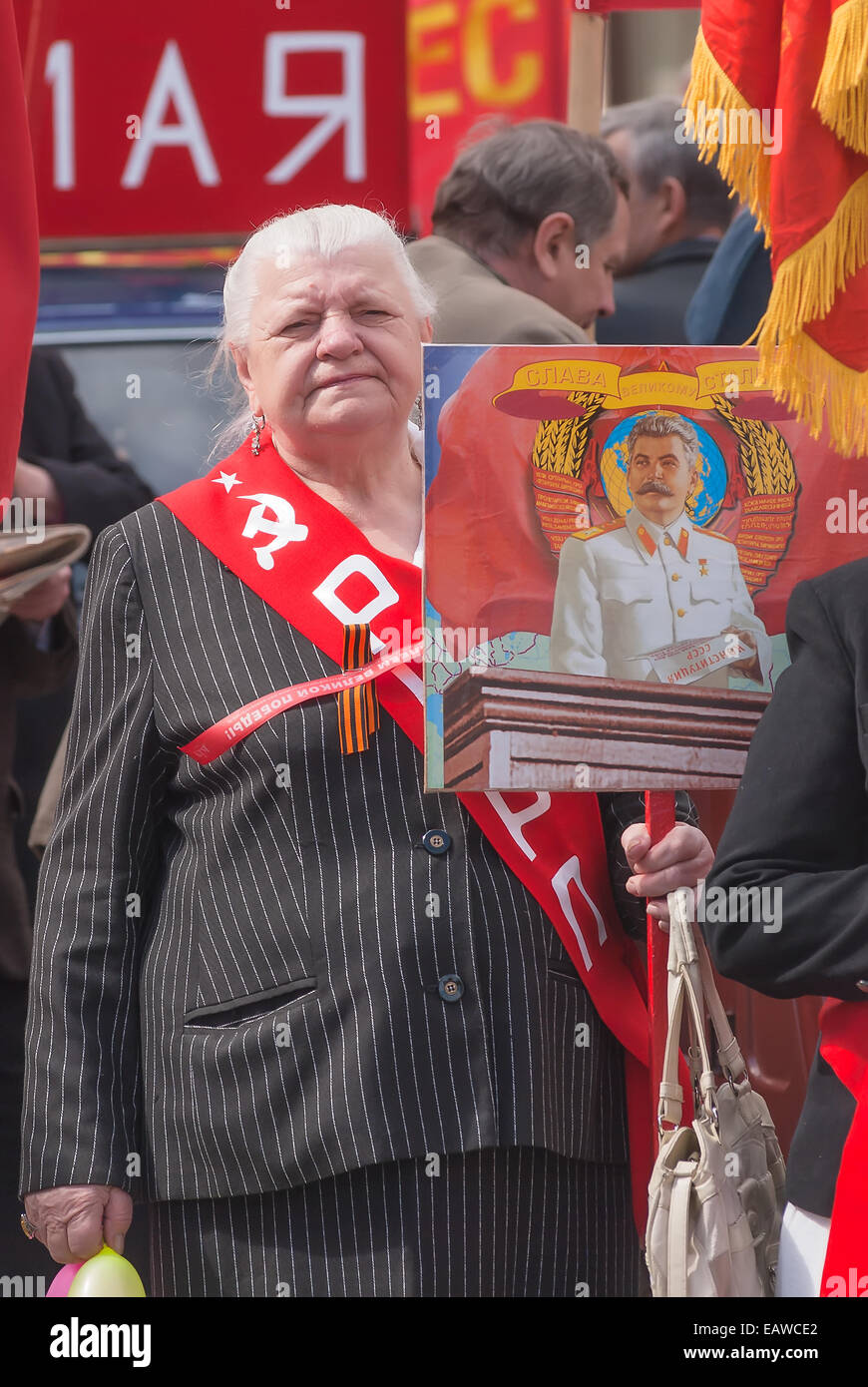 Old woman with Stalin's portrait on parade Stock Photo - Alamy