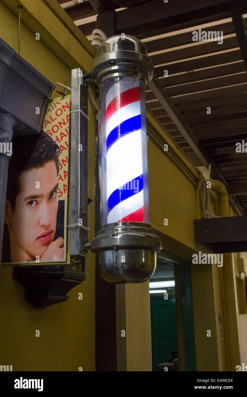 Barber shop spiral display in shopping mall Stock Photo - Alamy