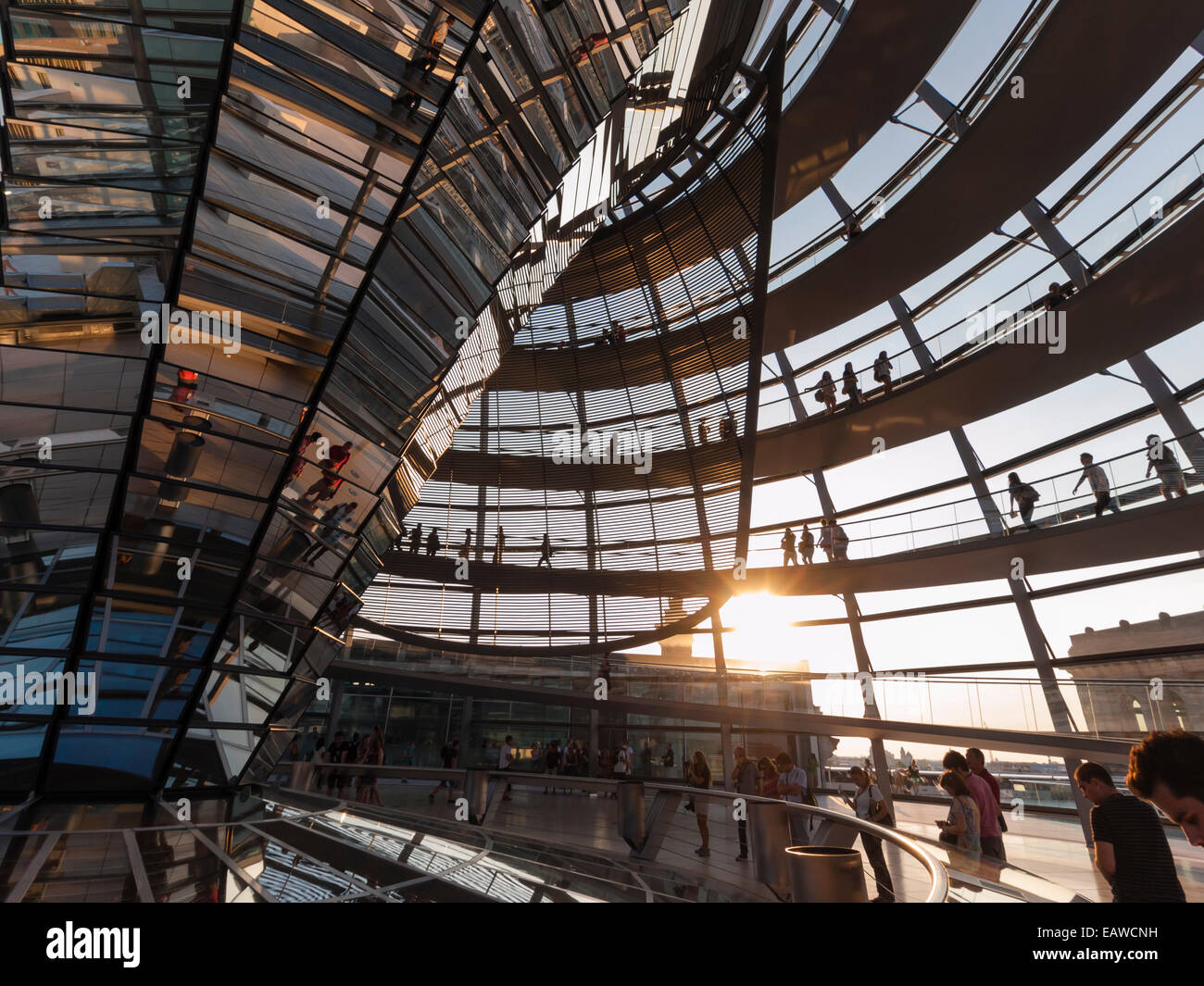Visitors are gathering beneath the glass dome on top of Berlin ...
