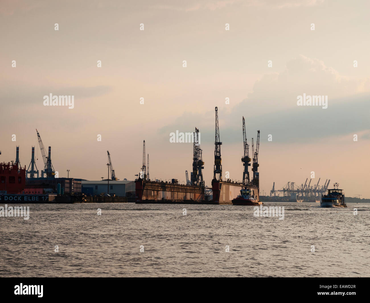 The sun is setting upon an empty dry dock of German shipbuilder "Blohm ...