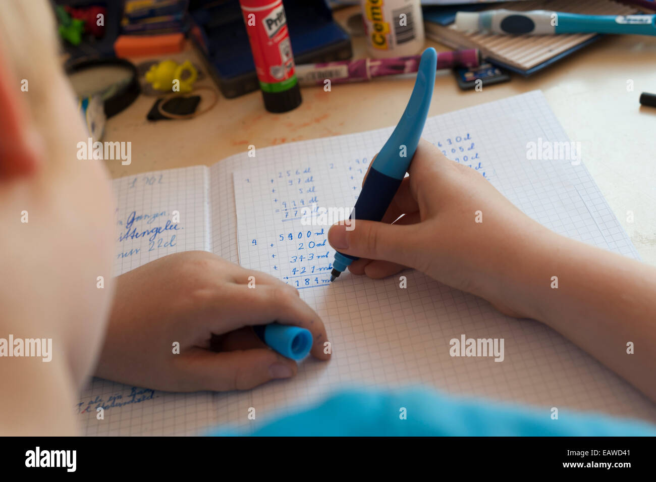 a 10-year old schoolchild is doing his math homework Stock Photo - Alamy