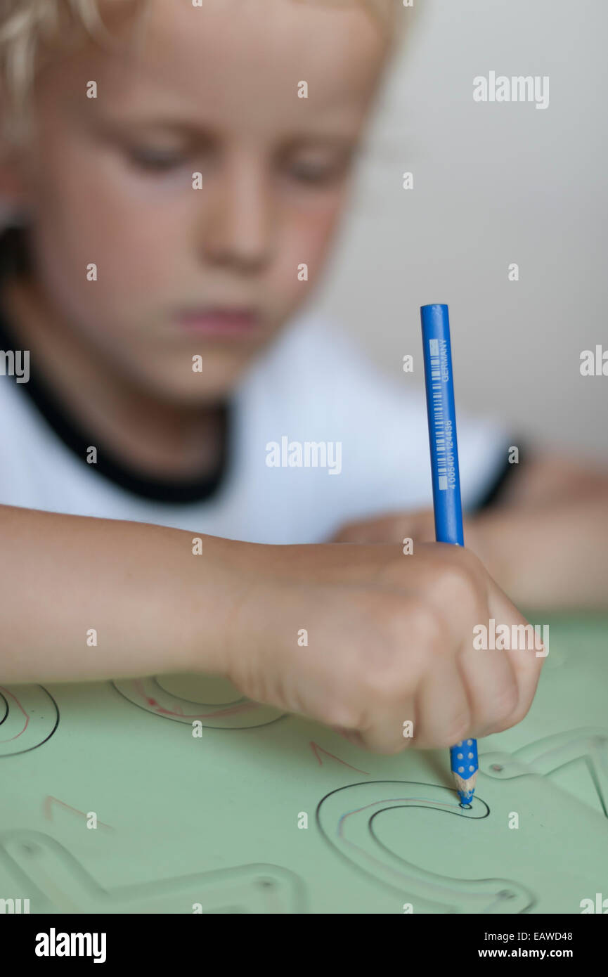 A 7 year Old Schoolchild Is Doing Writing Exercises As Homework For a-7-year-old-schoolchild-is-doing-writing-exercises-as-homework-for