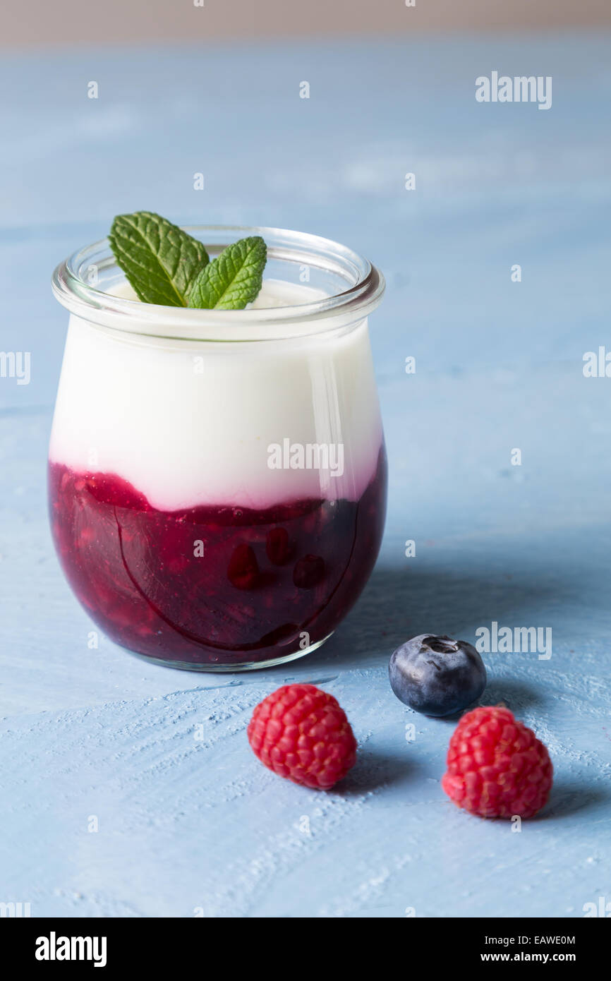 Red fruit compote with mint leaves and fruit Stock Photo - Alamy