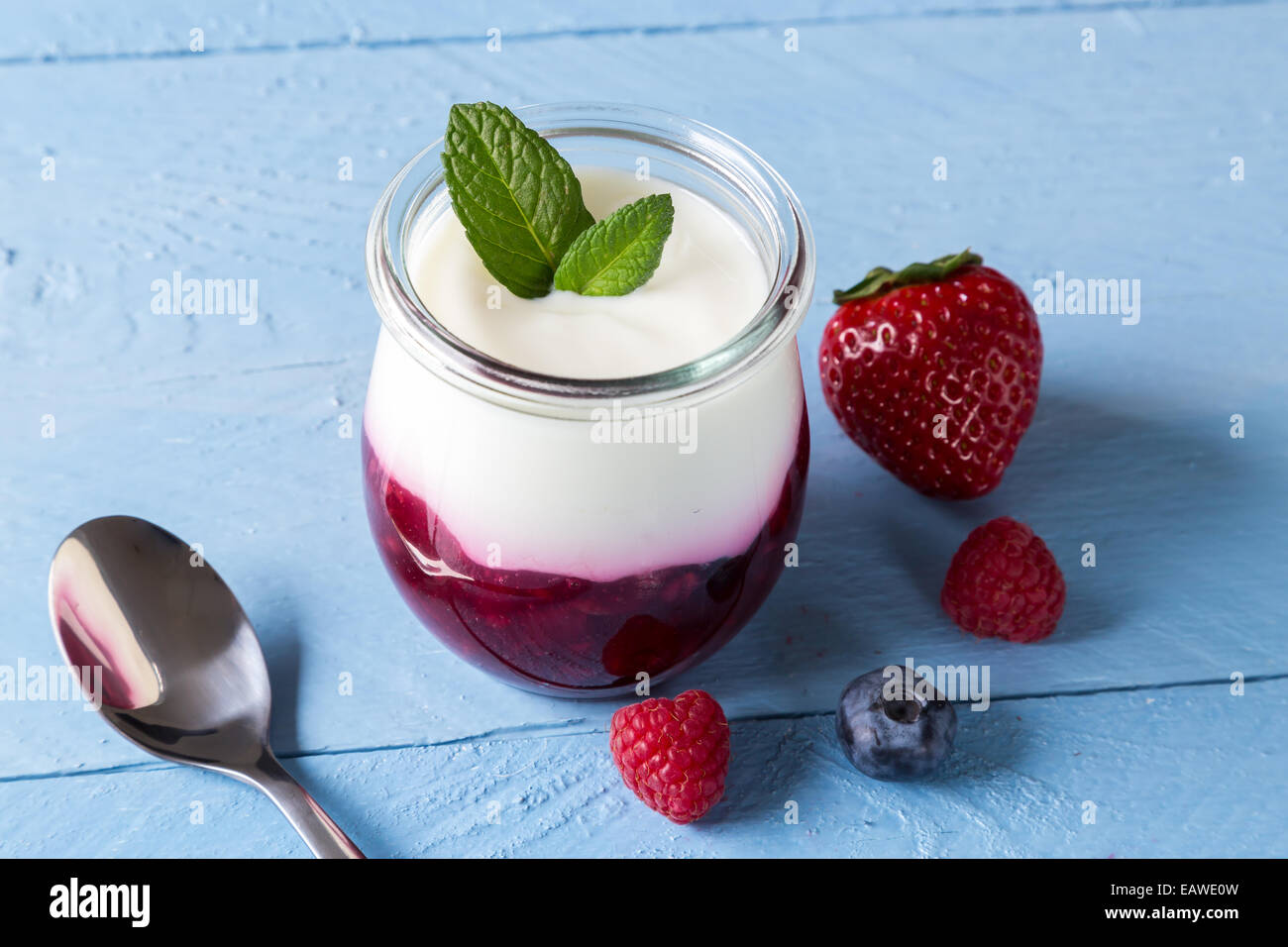 Red fruit compote with mint leaves and fruit Stock Photo - Alamy