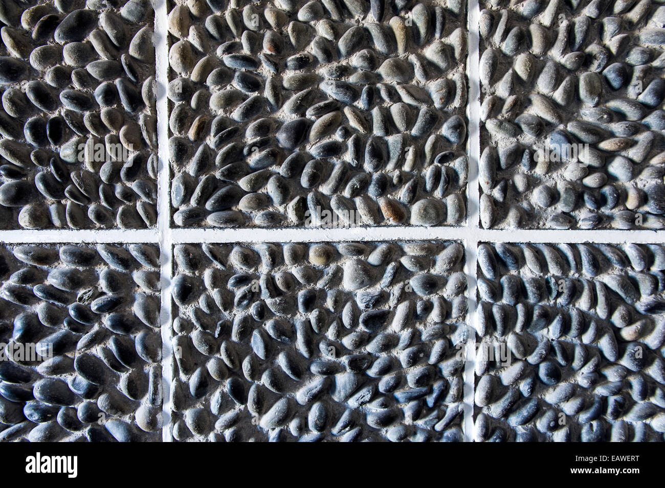 A textured prison wall imbedded with stones and pebbles Stock Photo - Alamy