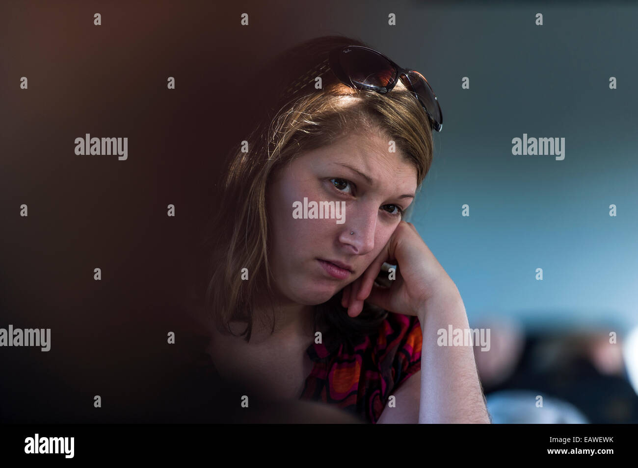 A tourist listens to a lecture from an ex-convict on a prison tour ...