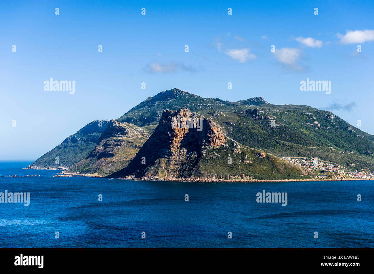 A rugged mountain range falling with sheer cliffs into the ocean Stock ...
