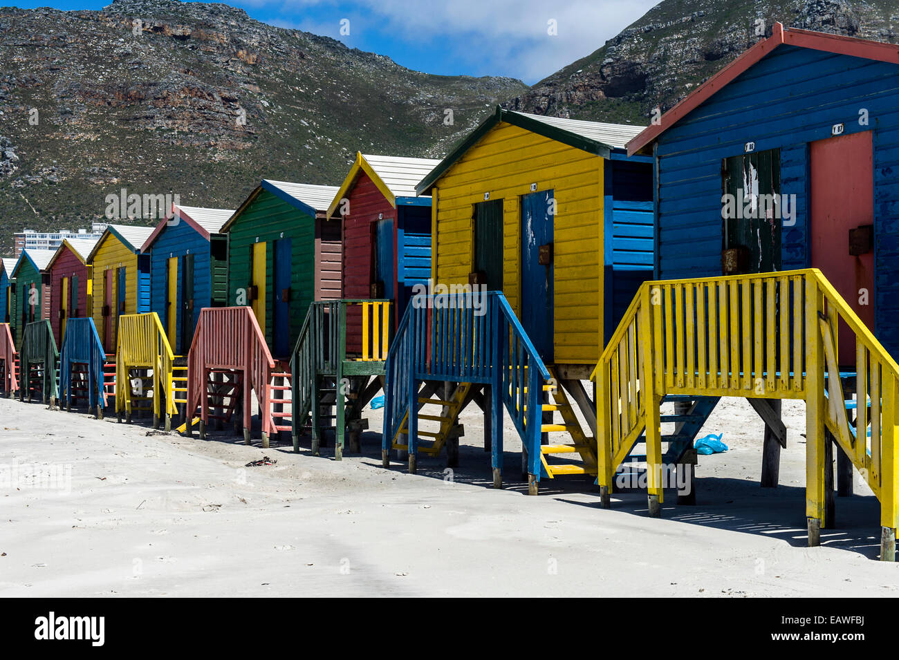 Brightly painted bathing boxes on stilts on the beach in summer Stock ...