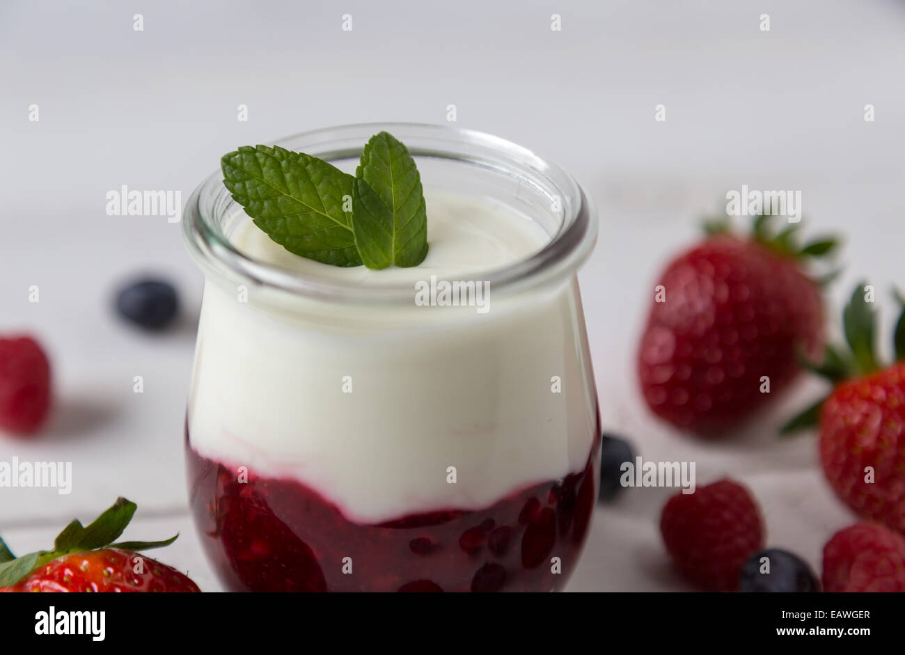 Red fruit compote with mint leaves and fruit Stock Photo - Alamy