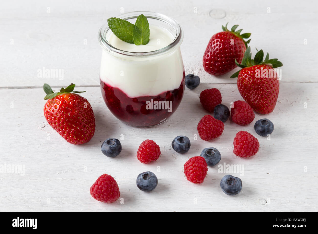Red fruit compote with mint leaves and fruit Stock Photo - Alamy
