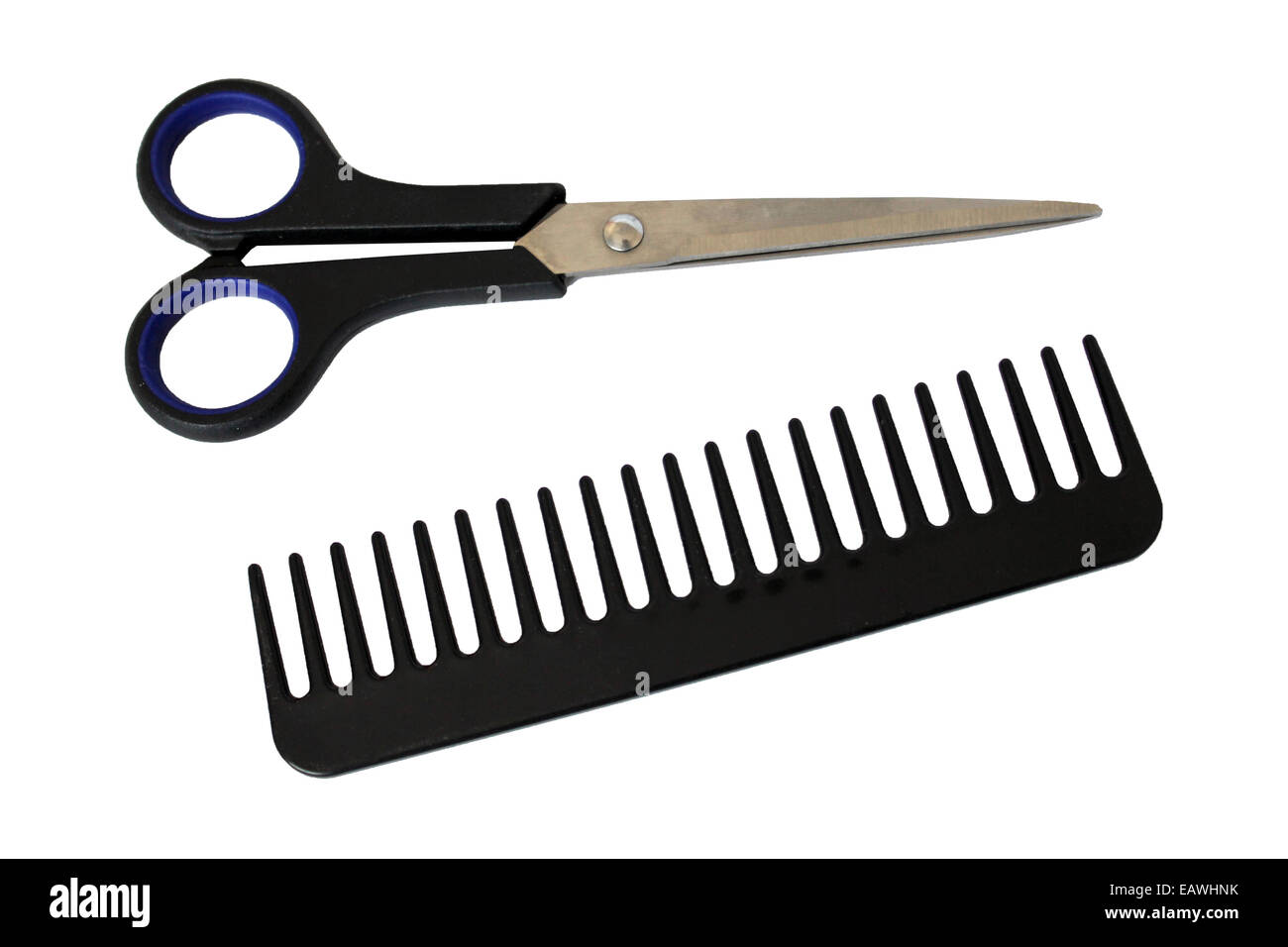 Scissors and comb isolated on white background Stock Photo - Alamy